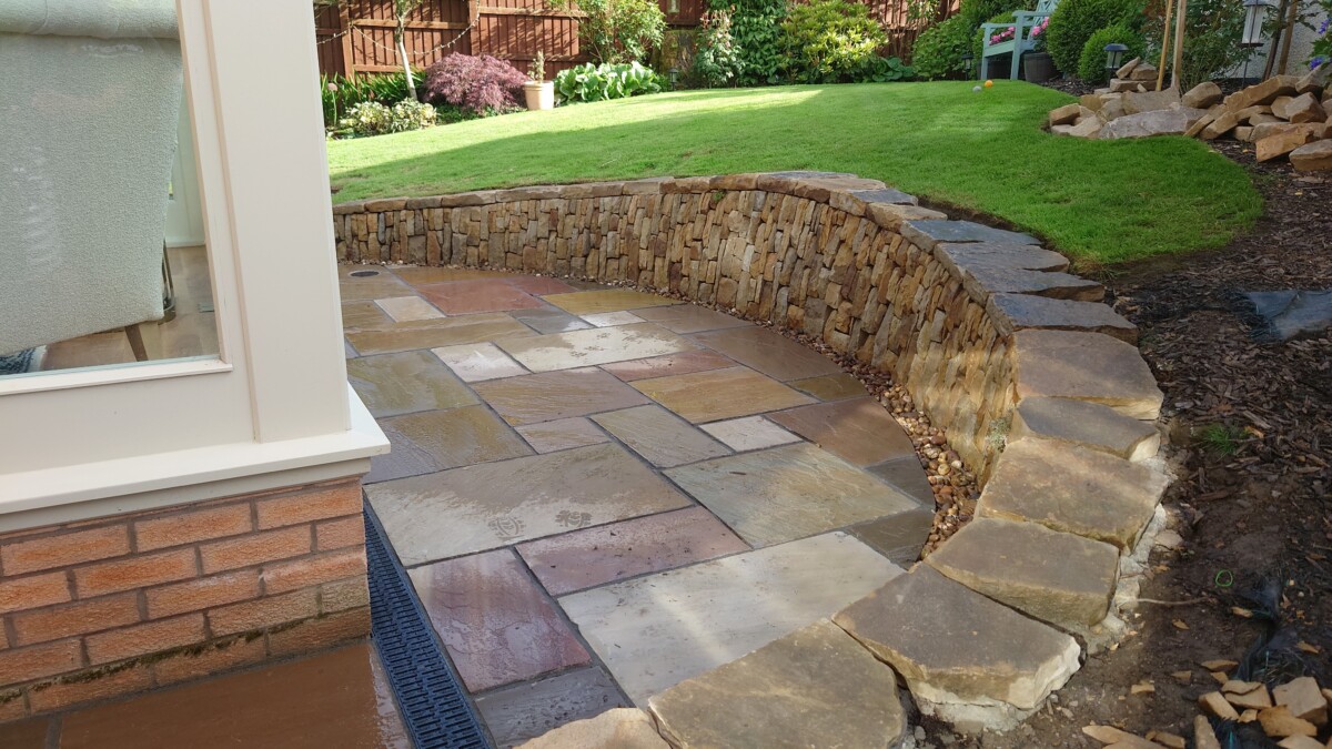 Stone Inspired Livingston back garden patio and dry stone retaining ...