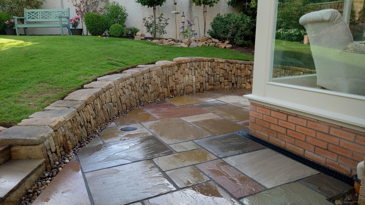 Stone Inspired Livingston back garden patio and dry stone retaining ...