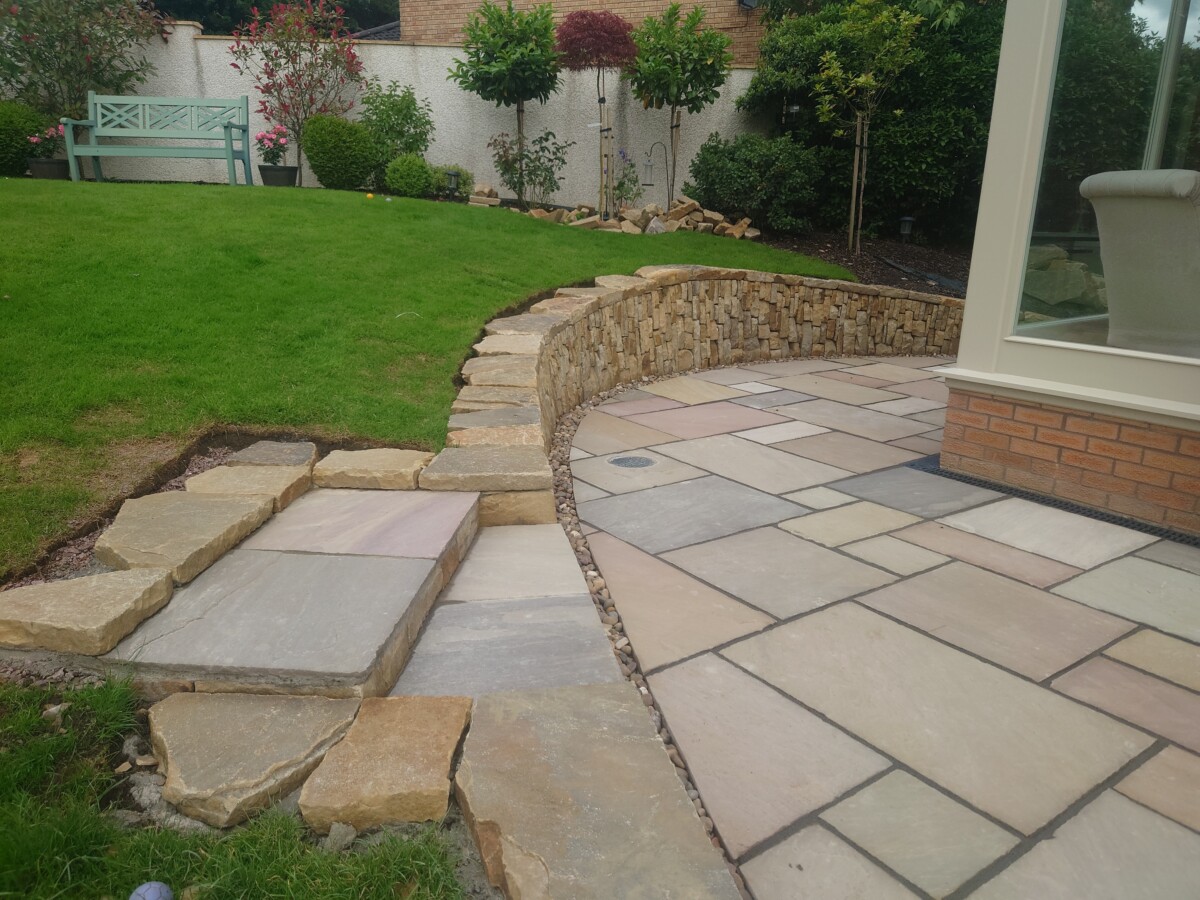 Stone Inspired Livingston back garden patio and dry stone retaining ...