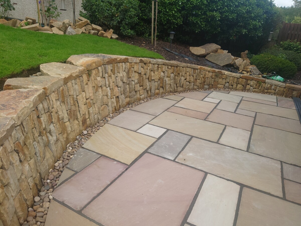 Stone Inspired Livingston back garden patio and dry stone retaining ...