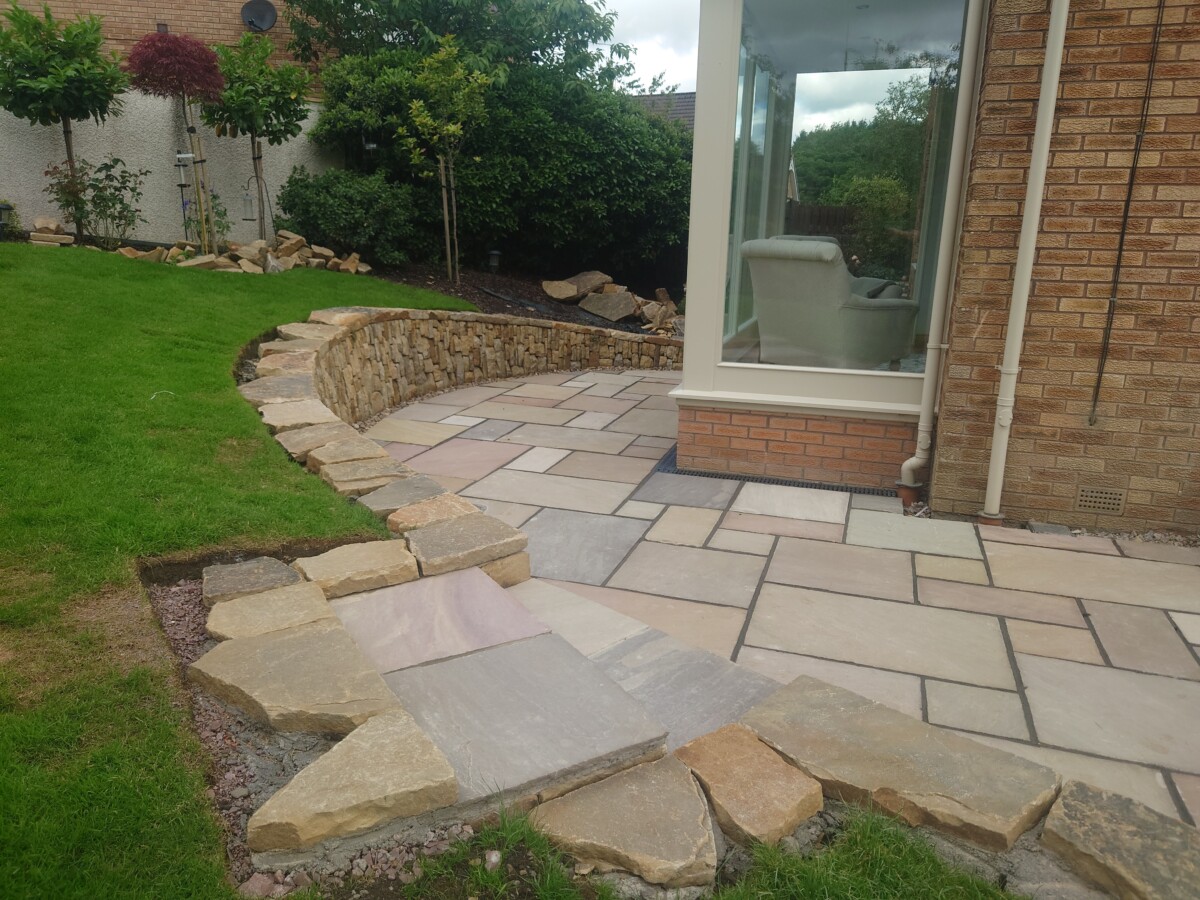 Stone Inspired Livingston back garden patio and dry stone retaining ...